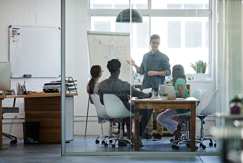Making an Important Point. a Group of Coworkers in a Boardroom Meeting ...