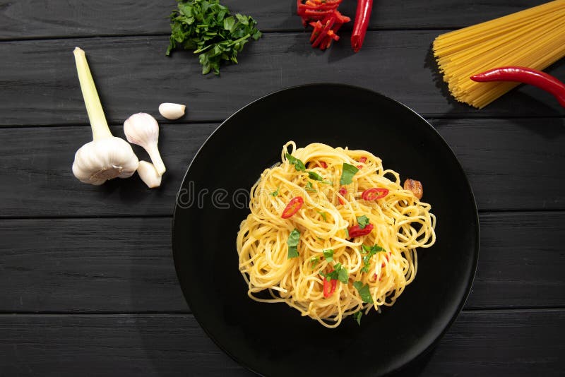 Making Italian Pasta at Home. Cooked Spaghetti on a Black Background ...
