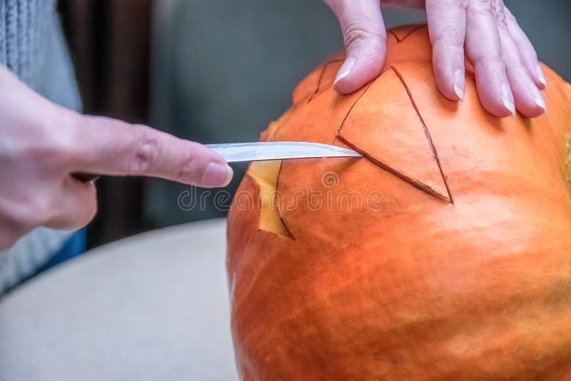Making a Jack O Lantern with a Pumpkin Head for Halloween. Preparing ...
