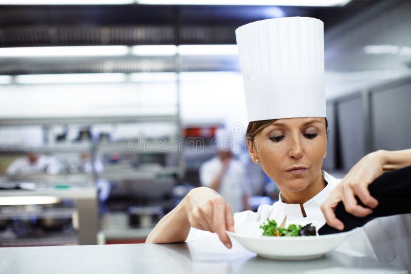 Making Magic in the Kitchen. Portrait of a Chef in a Professional ...