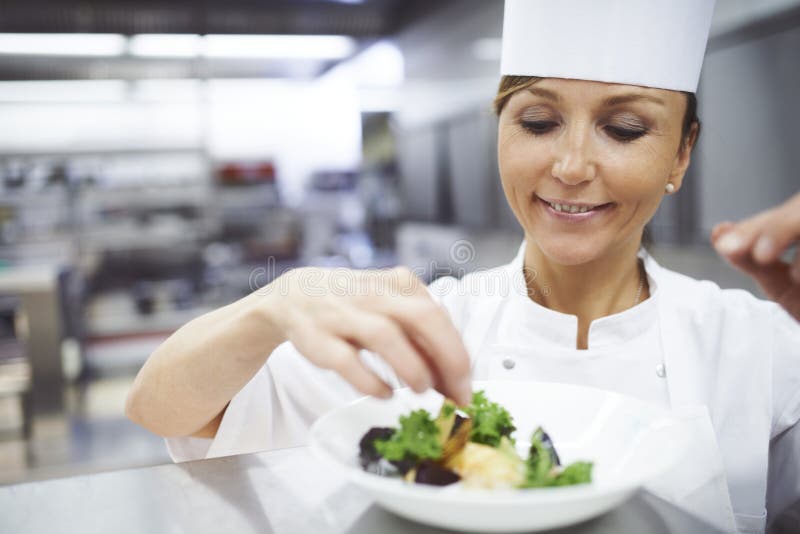 Making Magic on a Plate. a Chef Putting the Final Touches on a Dinner ...