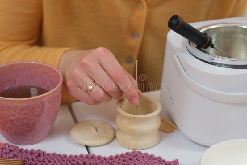 The Process Of Making A Massage Candle Using Ingredients Oils And Wax Measure Weigh Stir Add
