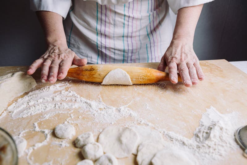Making Meat Dumpling with Wooden Rolling Pin. Stock Photo - Image of ...