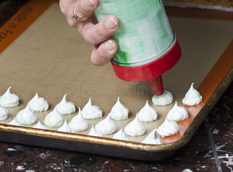 Making Meringues stock image. Image of squeeze, food - 22495443