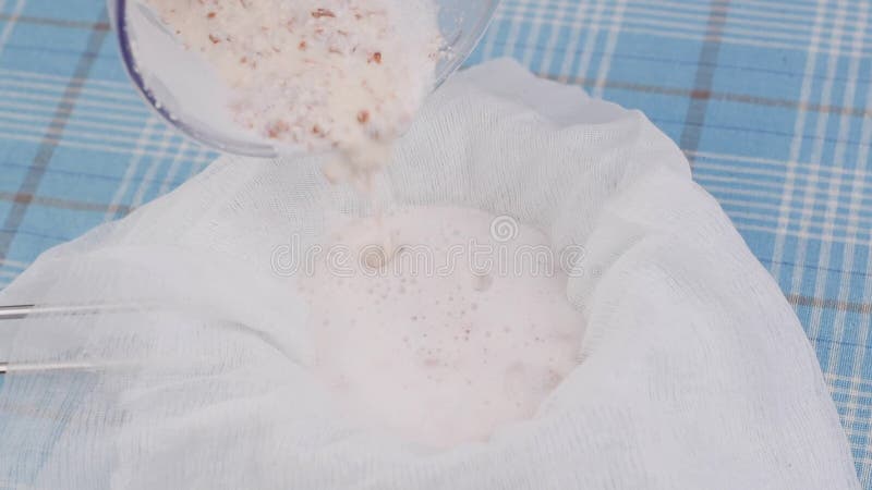 Making a Mess while Putting Water in a Jug with Almonds and Blending ...
