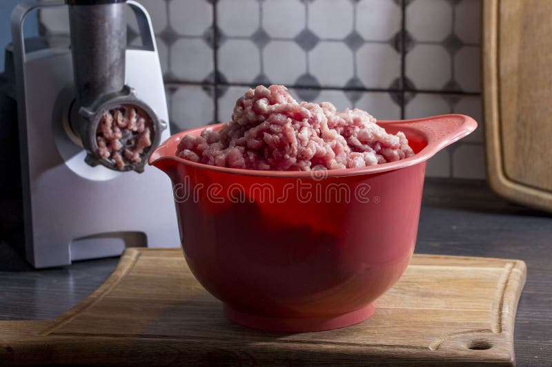 Making Minced Meat Using a Meat Grinder. Minced Meat in a Colored Bowl ...