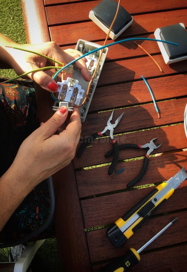 Making a multiple socket stock image. Image of woman - 148563345