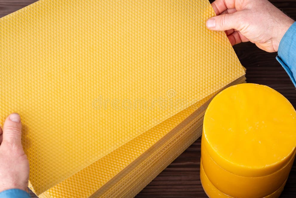 Making New Sheets of Wax, Man Looking Them through Stock Photo - Image ...