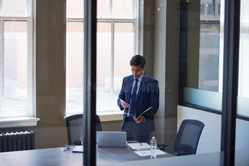 Making a Note of Some Important Information. a Businessman Looking at ...