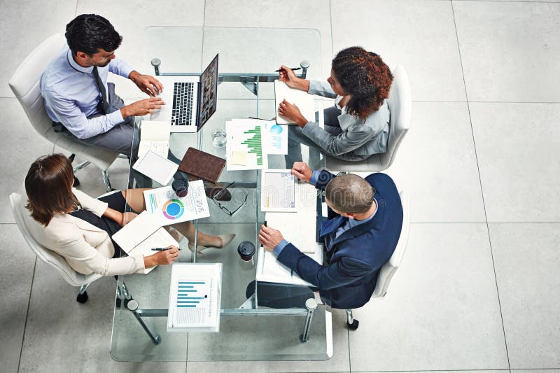 Making the Numbers Work with Teamwork. High Angle Shot of a Group of ...