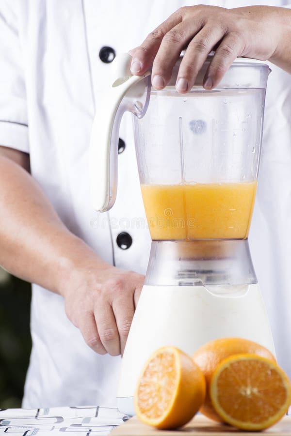 Making Orange Juice Smoothie Stock Photo - Image of fruit, restaurant ...