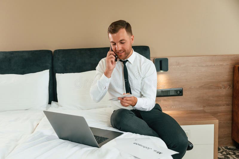 Making Payment by Using Phone and Terminal. a Man in a Black Jacket at ...