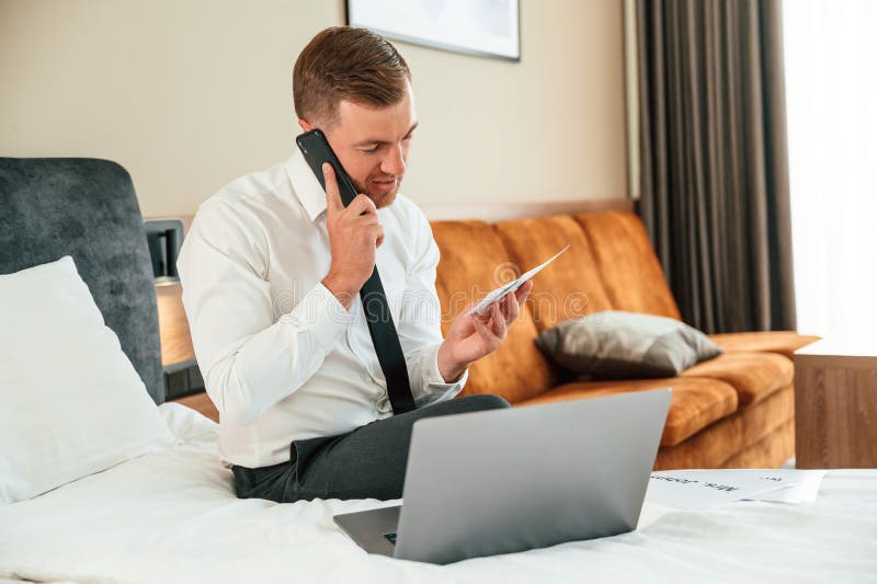 Making Payment by Using Phone and Terminal. a Man in a Black Jacket at ...
