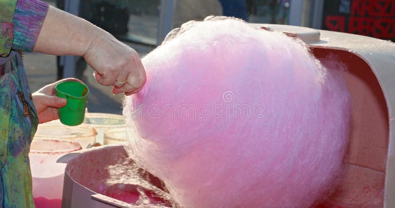 Making a pink candy-floss stock photo. Image of fluffy - 137538396