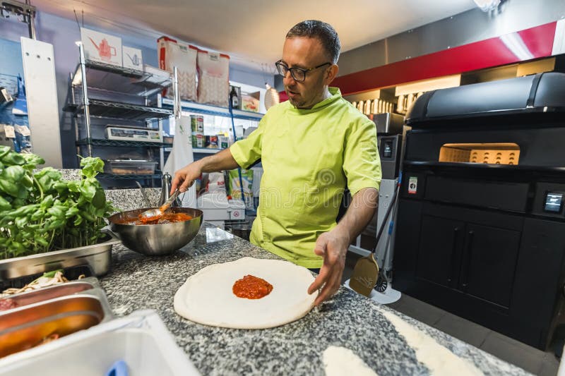 Making Pizza in the Kitchen, Chef Working in the Restaurant Stock Photo ...