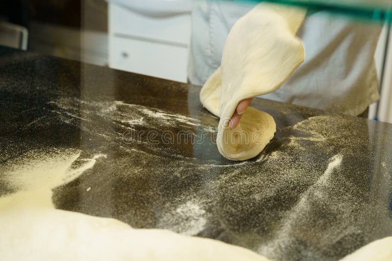 Making a Pizza, Kneading, Stretching, Flipping the Pizza Dough Stock ...