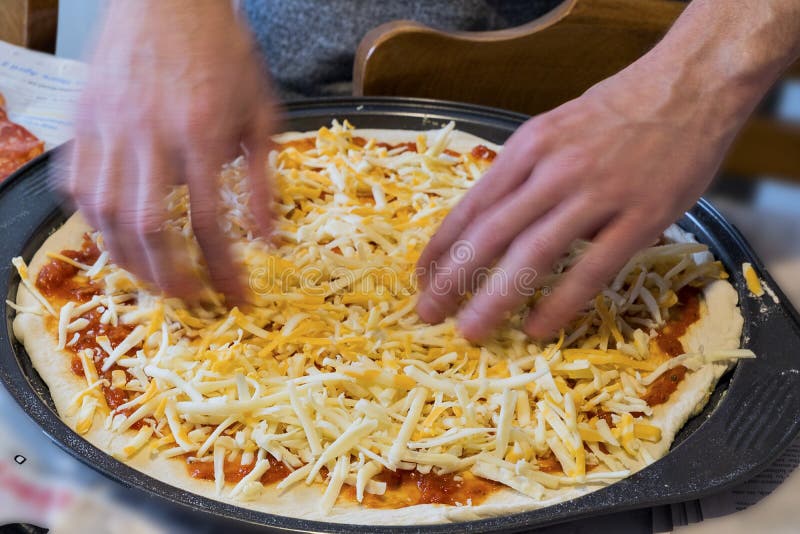 Making pizza stock image. Image of meal, hands, baked - 182262917