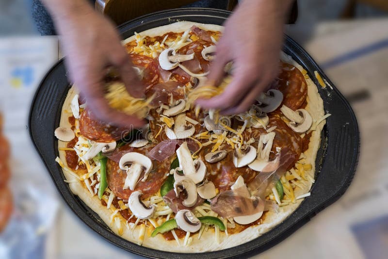 Making pizza stock photo. Image of pizza, table, baked - 182262982