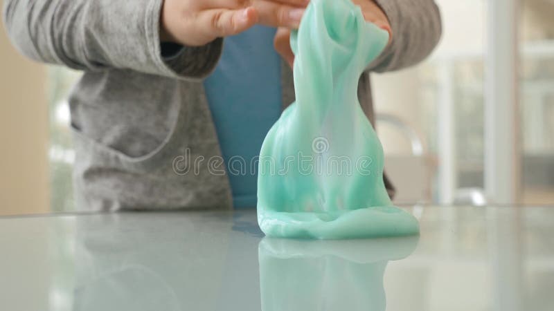 Making and Playing with Slime Stock Footage - Video of science ...