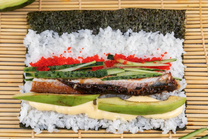 Making Rolled Sushi in a Bamboo Sushi Mat Stock Image - Image of ...