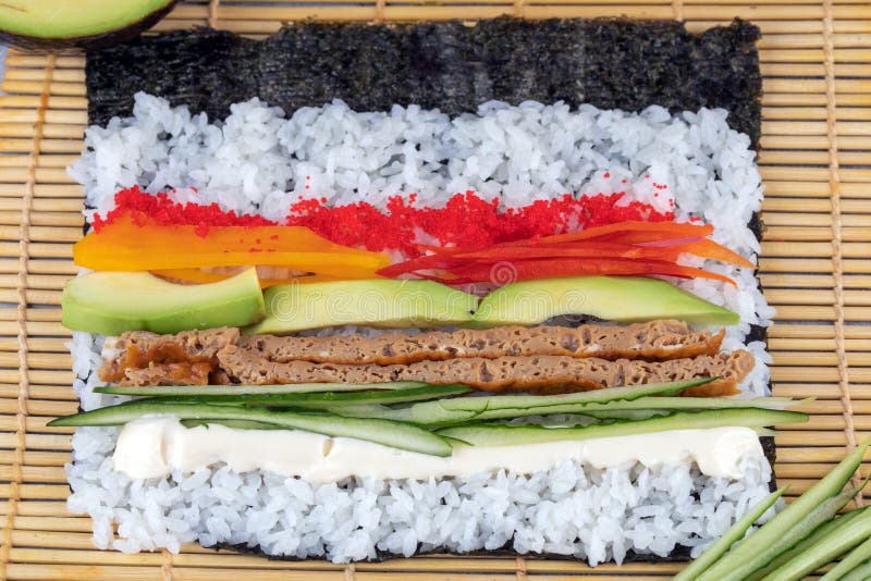 Making Rolled Sushi in a Bamboo Sushi Mat Stock Image - Image of ...