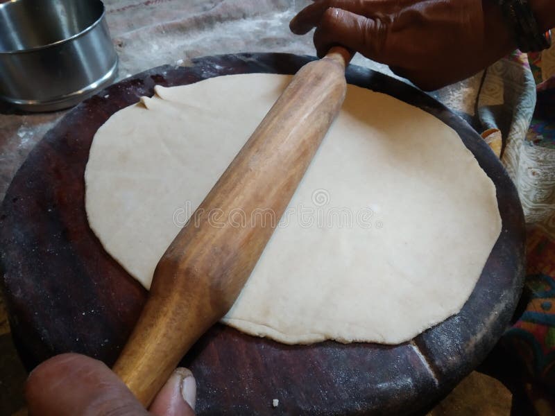 Making Roti with Hands on Wooden Flat Surface with Indian Tradition ...