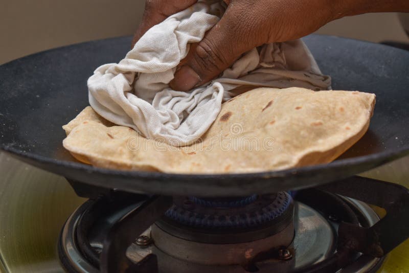 Making Roti Indian Chapati on Roti Tawa Made of Wheat Stock Image ...