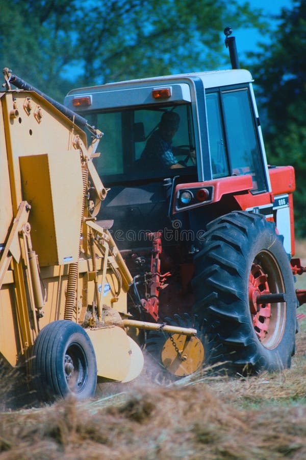 Making round hay stock image. Image of tractor, summer - 4539577