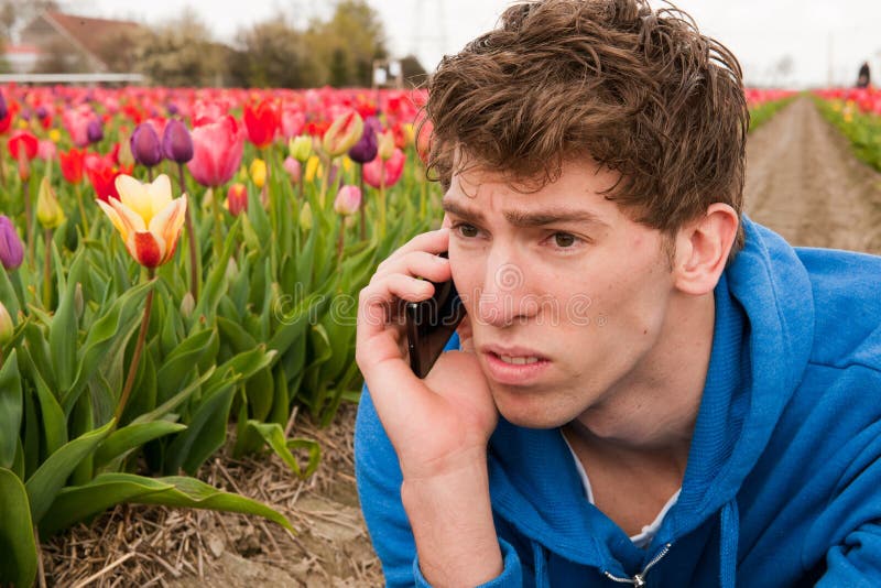 Making a sad phone call stock photo. Image of laying - 24565846