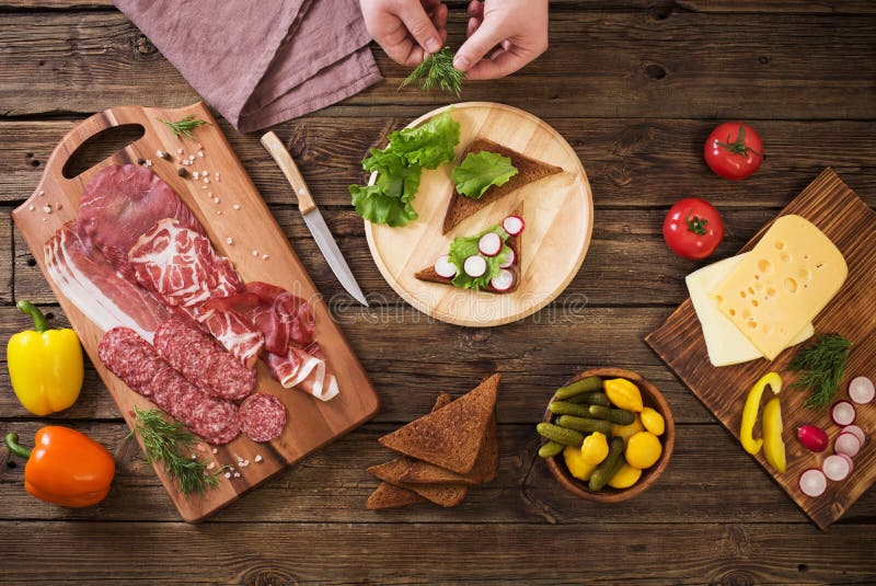 The Making Sandwiches with Meat and Sausage on Wooden Table Stock Image ...
