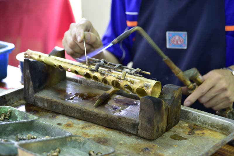 Making saxophone. stock photo. Image of component, making - 58065242