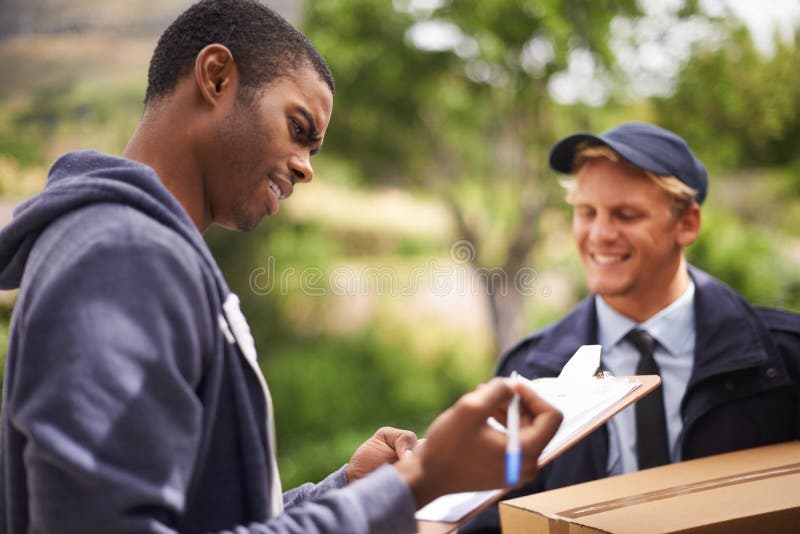 Making Sense of the Forms. a Handsome Young Man Signing a Form for a ...