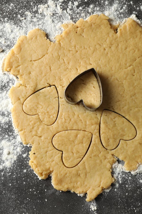 Making Shortcrust Pastry. Raw Dough and Cookie Cutter on Grey Table ...
