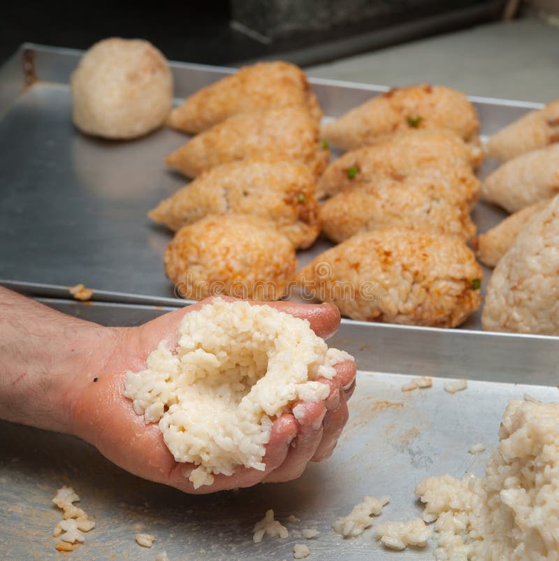 The Making of Sicilian Arancini Stock Photo - Image of shape, cheese ...