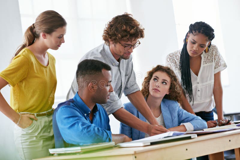 Making Some Adjustments To the Blueprints. a Group of Young Architects ...