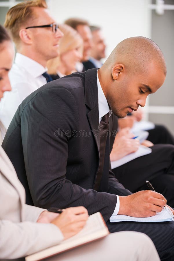 Making some urgent notes. stock photo. Image of group - 44368452