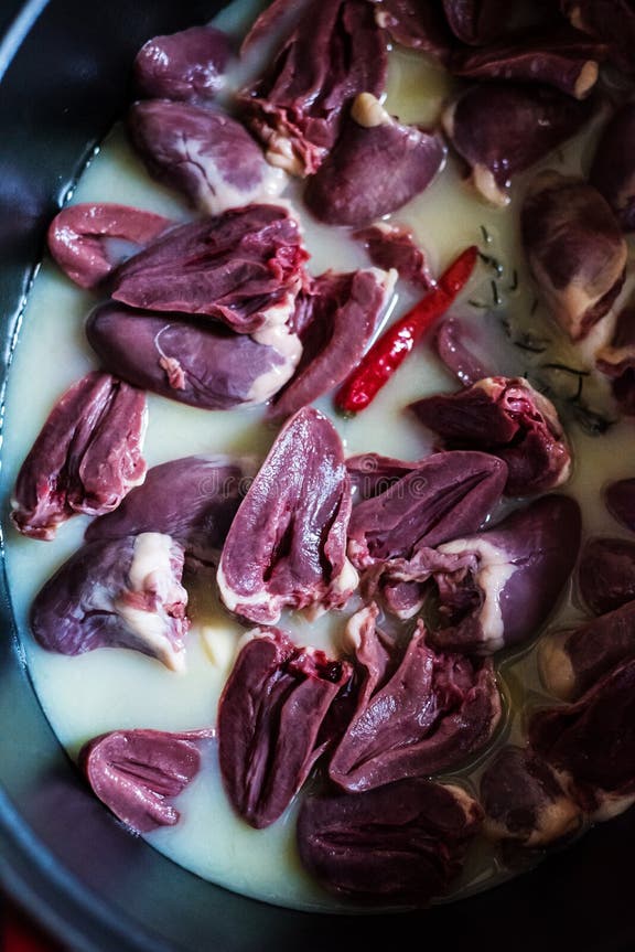 Making Stew of Duck Hearts and Garlic Stock Photo - Image of duck ...