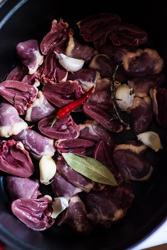 Making Stew of Duck Hearts and Garlic Stock Image - Image of meat, cast ...