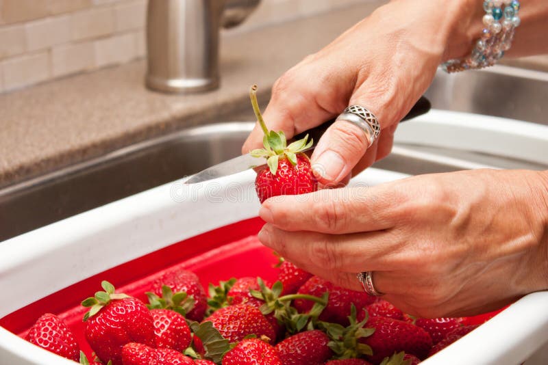 Woman Washing Strawberries stock image. Image of clean - 8176445