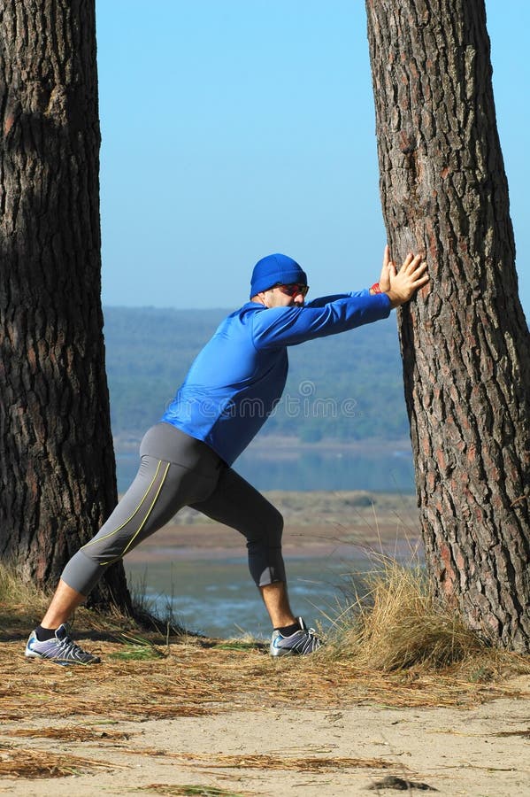 Making Stretching Movements Stock Photo - Image of outdoor, jogging ...