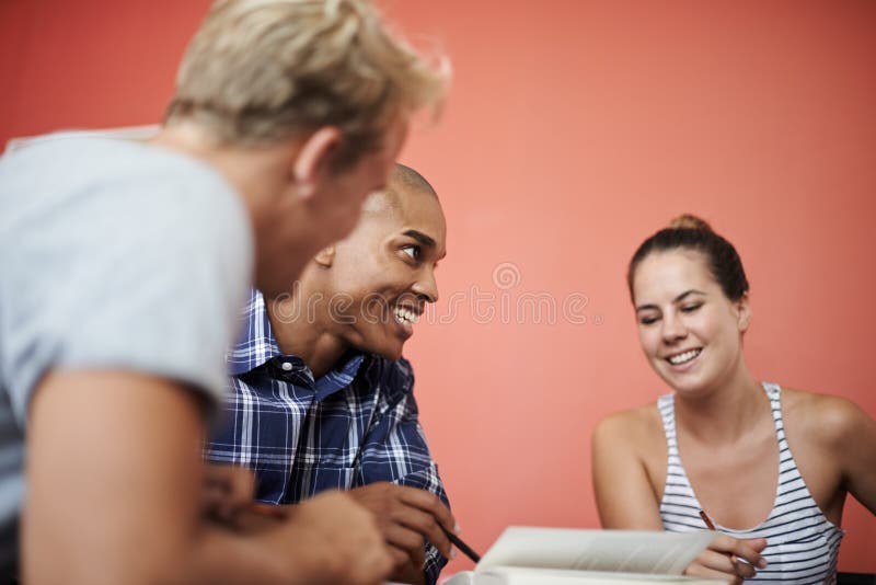 Making Study Easier. a Group of University Students Studying Together ...