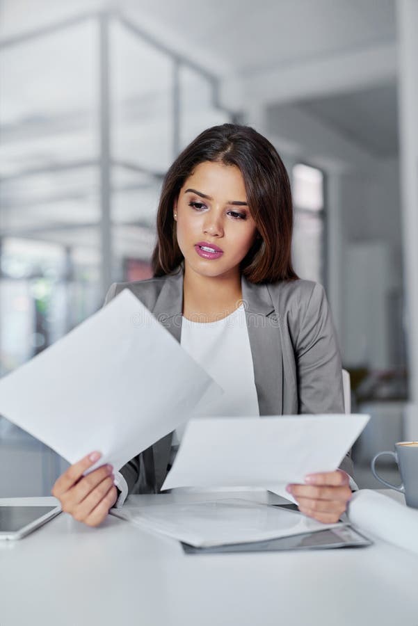 Making Sure the Documents are All in Order. a Young Businesswoman ...