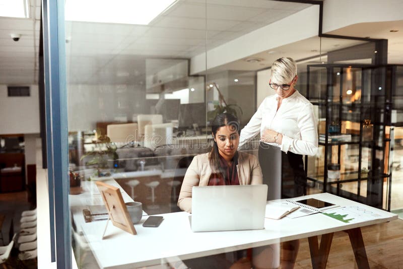 Making Sure Everything is Done Correctly. Two Businesswomen Working ... Making Sure Everything is Done Correctly. Two Businesswomen Working ...