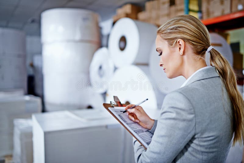 Making Sure the Order is Perfect. a Woman at Work in a Storage ...