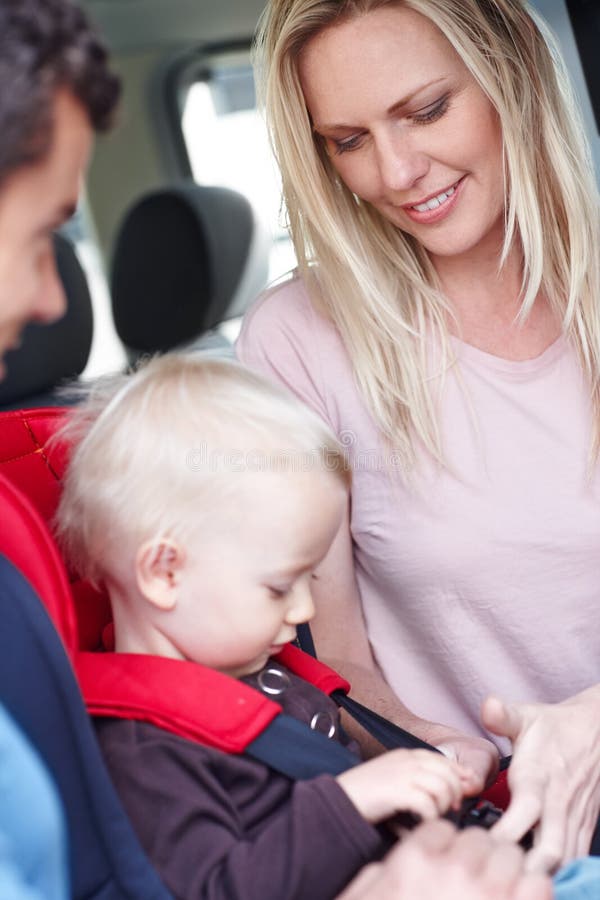 Making Sure Our Son is Safe. a Mother and Father Helping Their Child in ... Making Sure Our Son is Safe. a Mother and Father Helping Their Child in ...