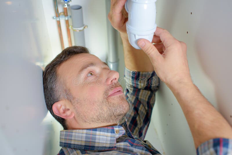 Making Sure Pipe Tightly Sealed Stock Image - Image of friendly ...