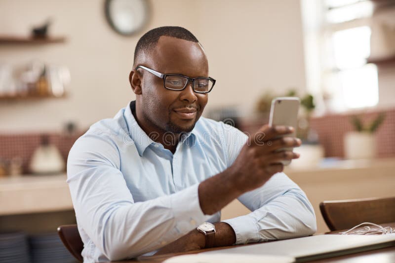 Making Sure he Stays Connected. a Handsome Young Businessman Sending a ...