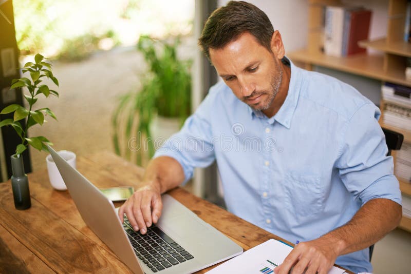 Making Sure There are No Loopholes. a Young Man Working from Home ...