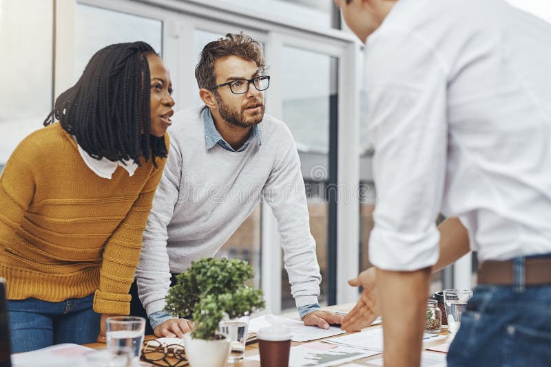 Making Sure they Understand. a Group of Businesspeople Having a ...