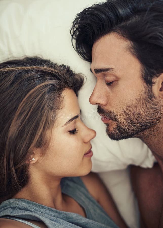 Making Sure they Wake Up To One Another. High Angle Shot of an Affectionate Young Couple ...